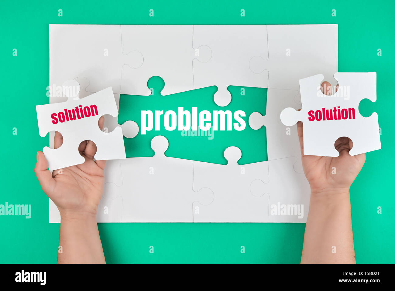 female hand holding white puzzle with the word solution, process of ...