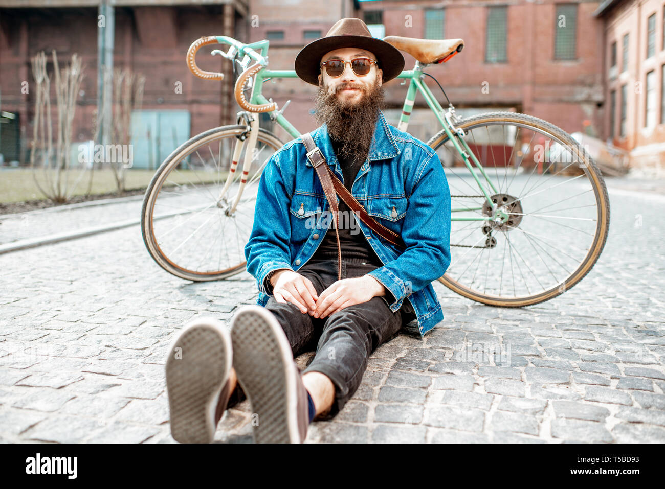 Portrait of a bearded hipster dressed stylishly with hat and jacket ...