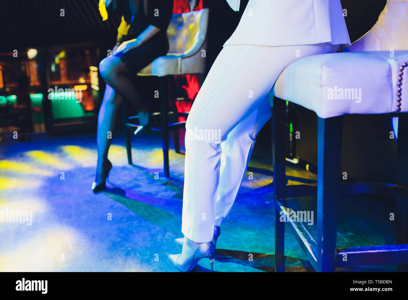 The female student is holding the black wireless microphone in the left ...