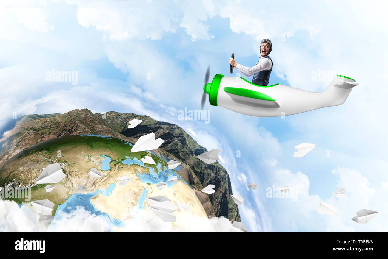 Happy pilot driving small propeller plane Stock Photo - Alamy