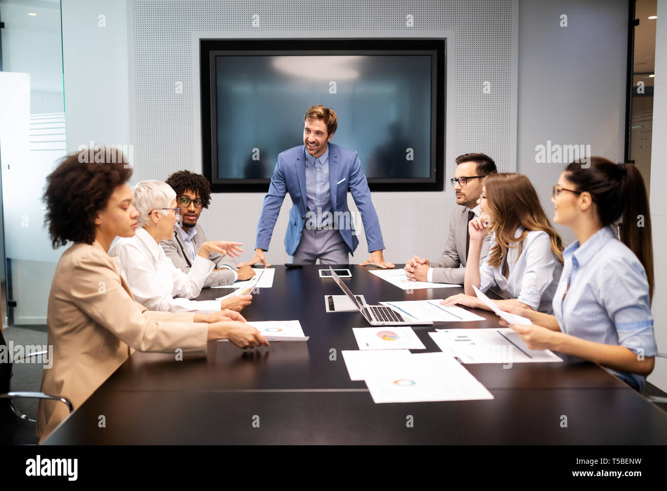 Corporate business team and manager in a meeting Stock Photo - Alamy