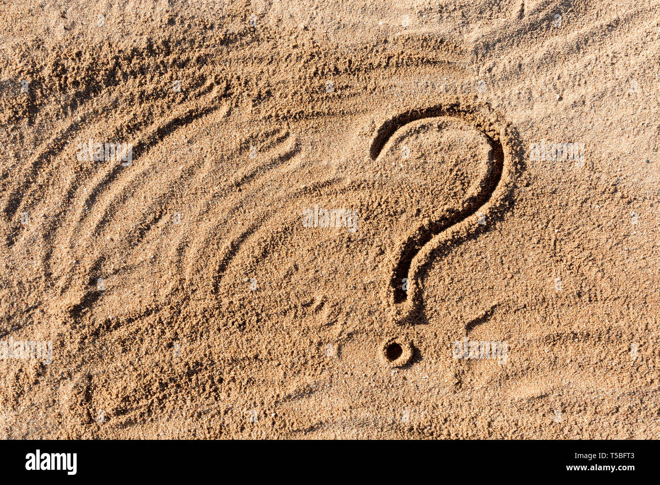 question marks written on beach sand close up, with copy space Stock ...