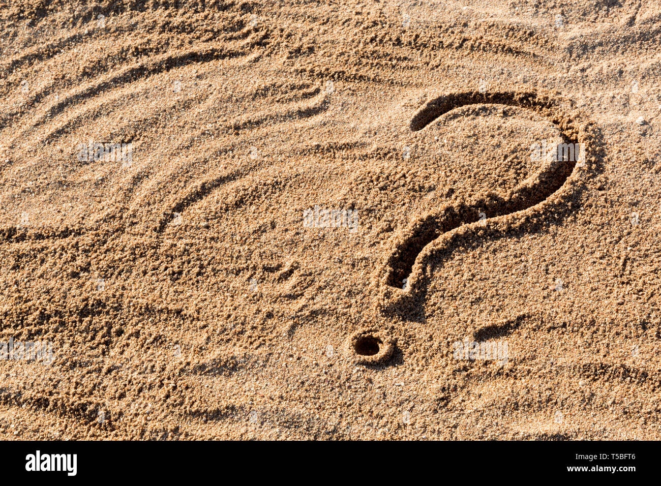 question marks written on beach sand close up, with copy space Stock ...
