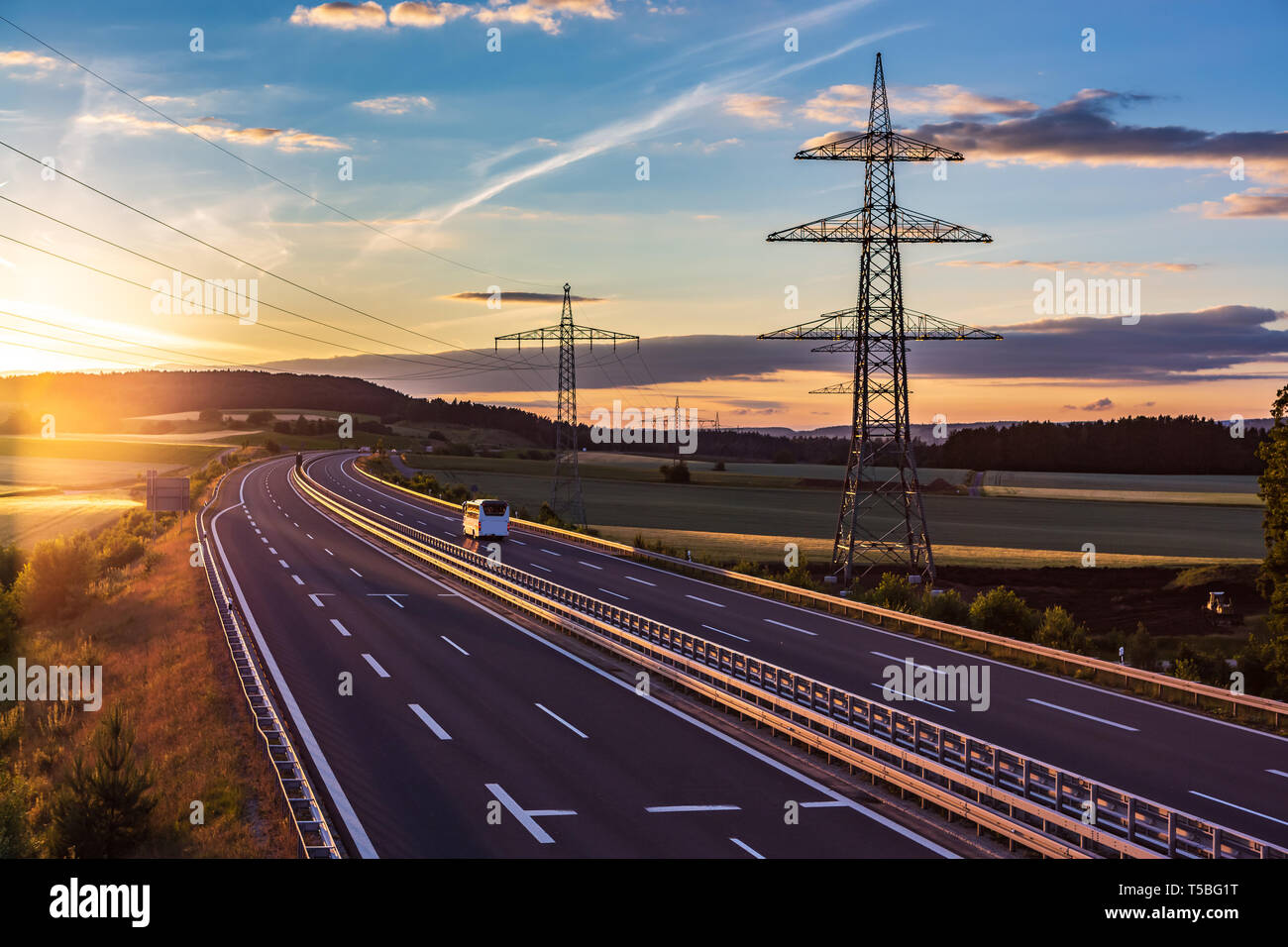 stretch of motorway in Germany by setting sun Stock Photo - Alamy