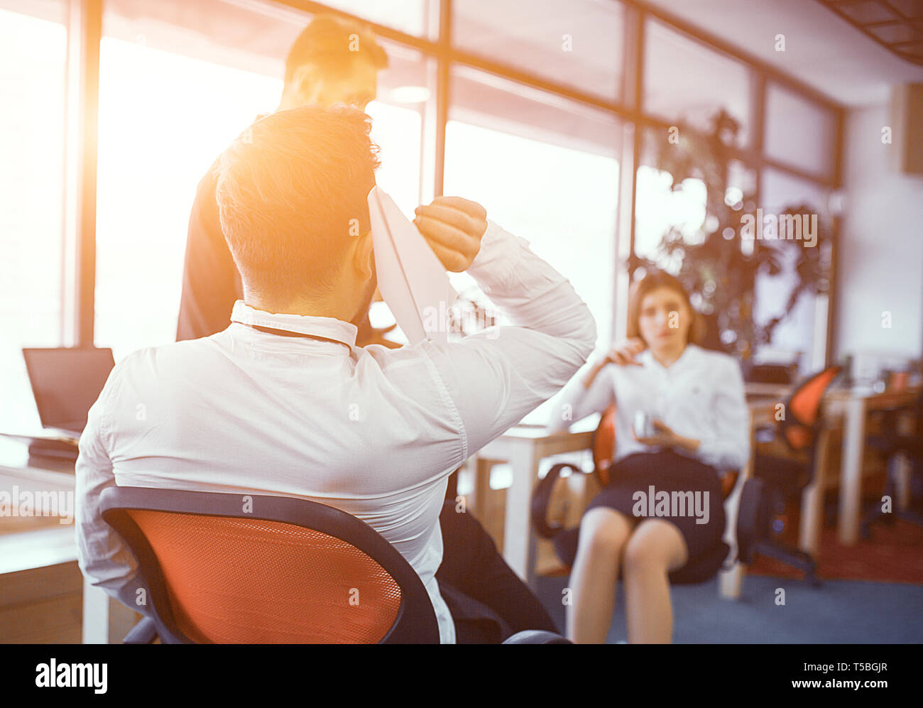 Office Worker Idle At Work And Launches Paper Airplanes In Sunny Office ...