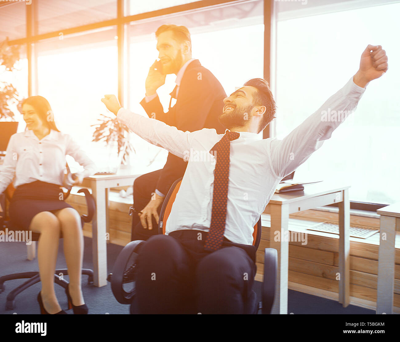 Colleagues Relaxing In Sunny Modern Office After Brainstorming Meeting ...