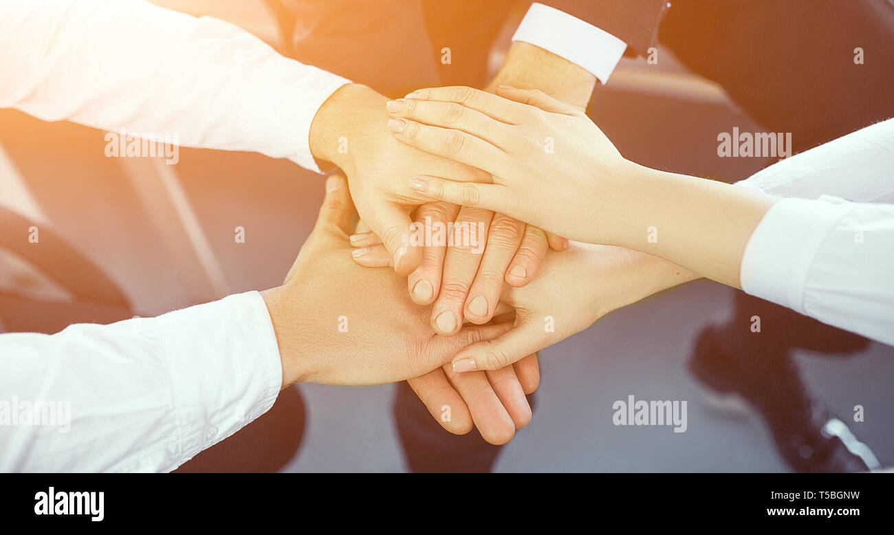 Male And Female Crossed Hands In Sunlight. Expressing Partnership ...