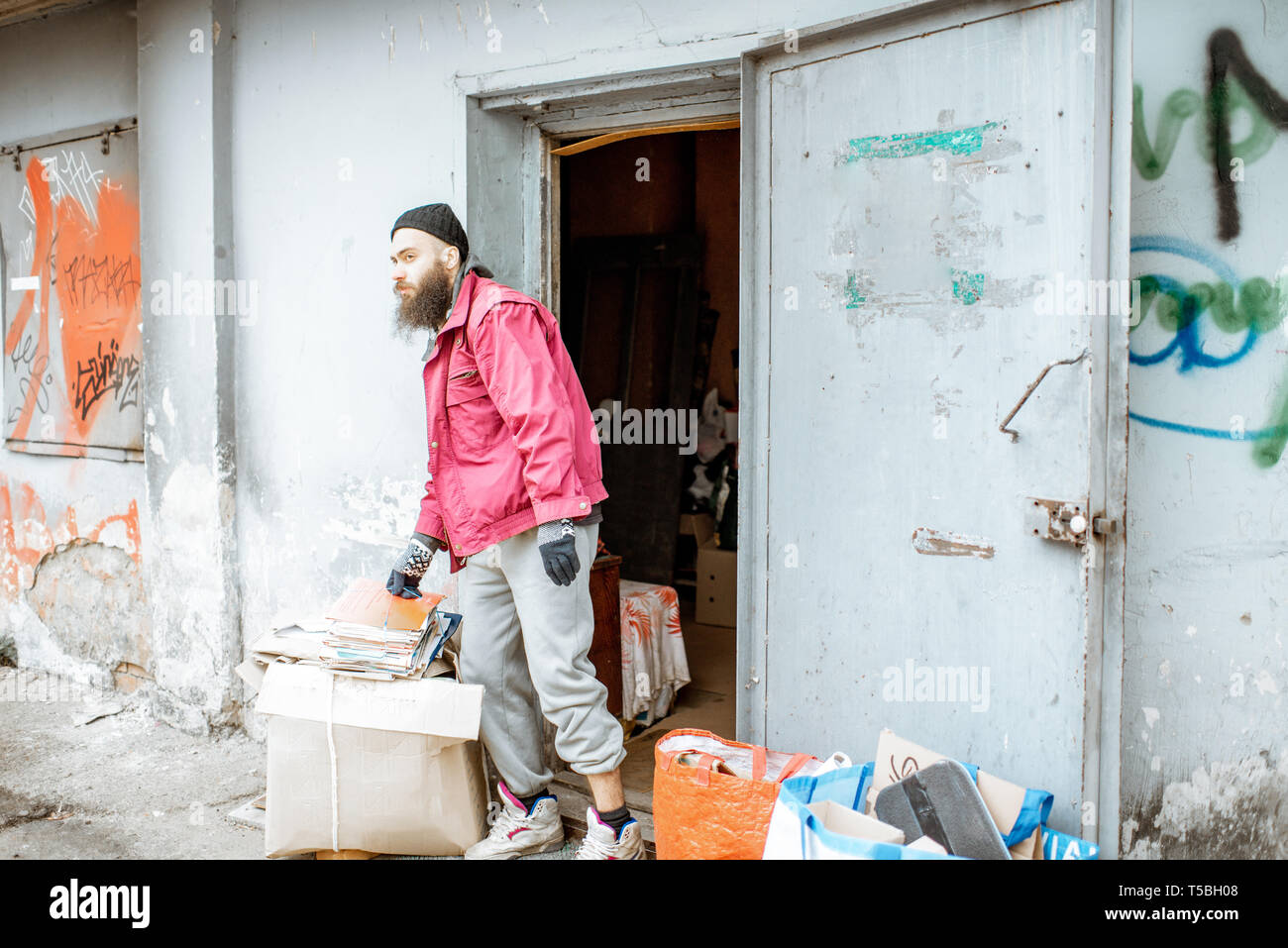 Homeless person collecting waste to recycle hi-res stock photography ...