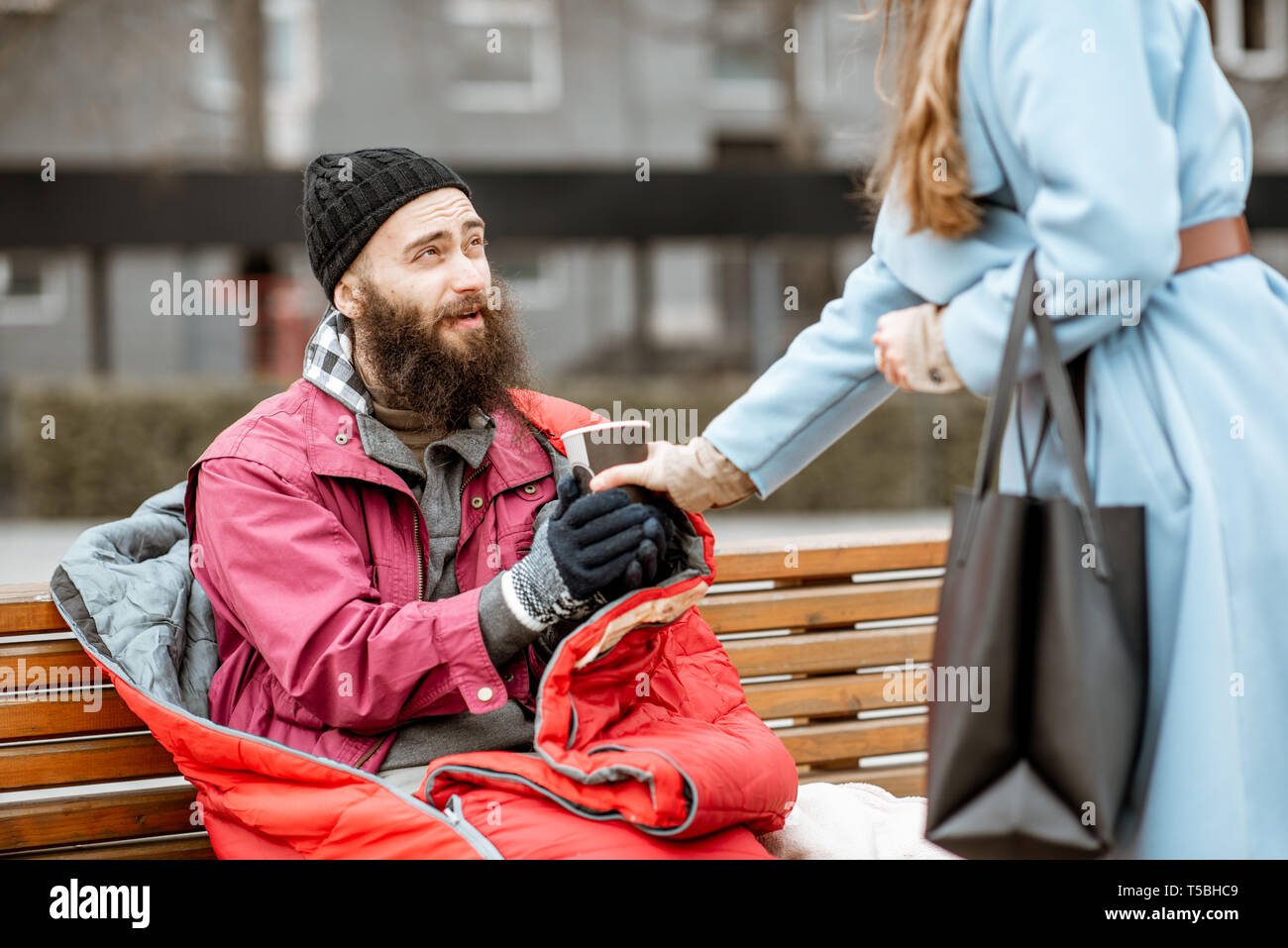 Someone Helping Poor People 21 Ways To Help Poor And Needy: Checklist