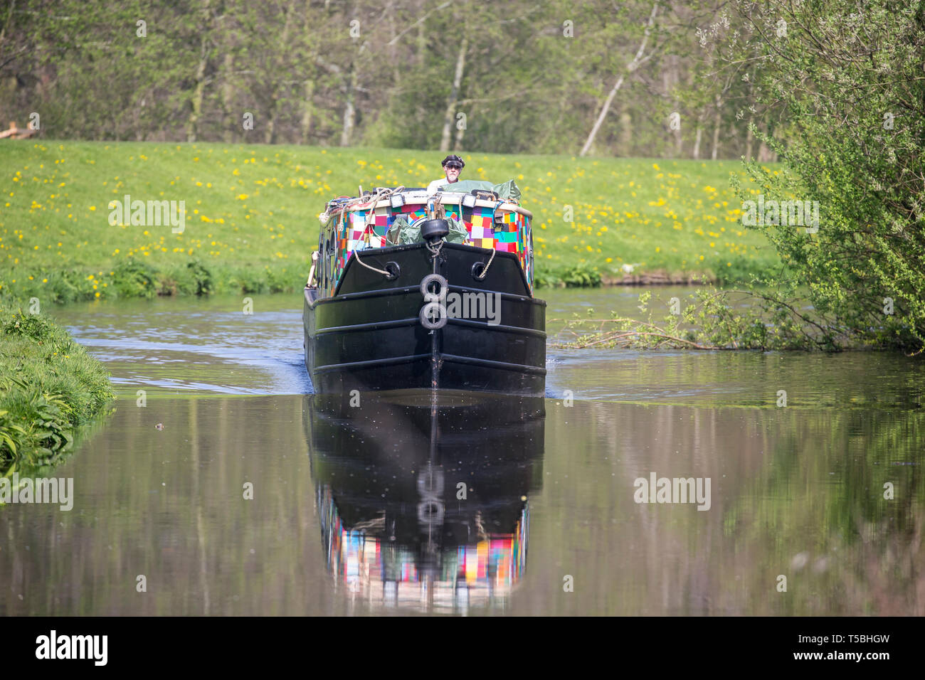 Front view of approaching, oncoming narrowboat, canal boat isolated on ...