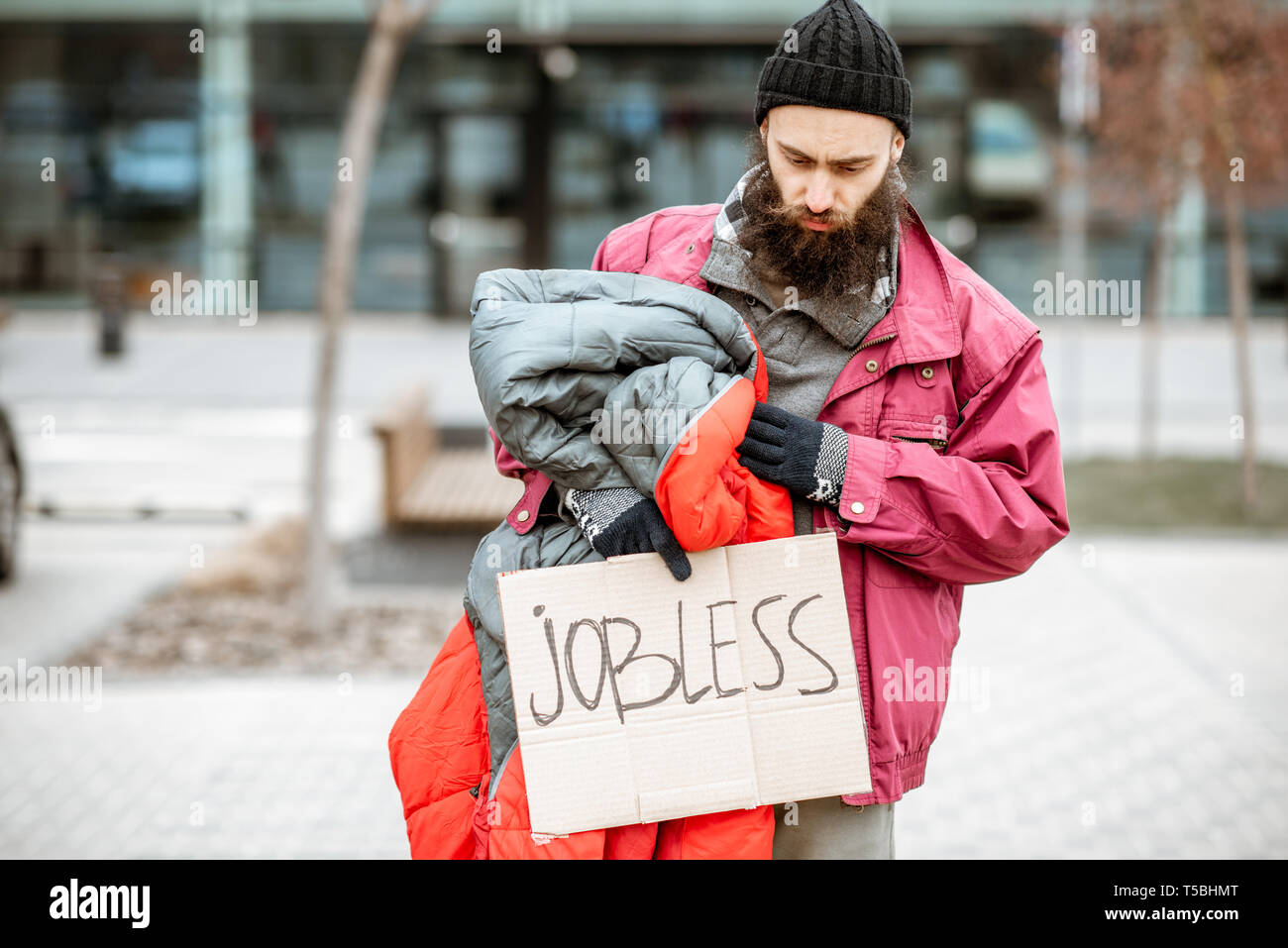 Homeless person standing hi-res stock photography and images - Alamy