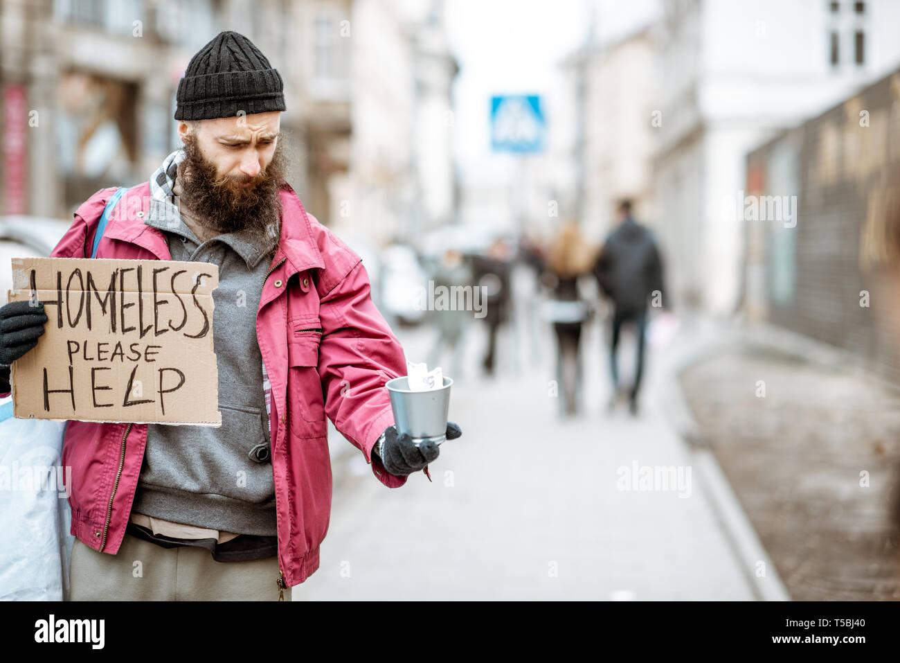 Beggar and passerby hi-res stock photography and images - Alamy