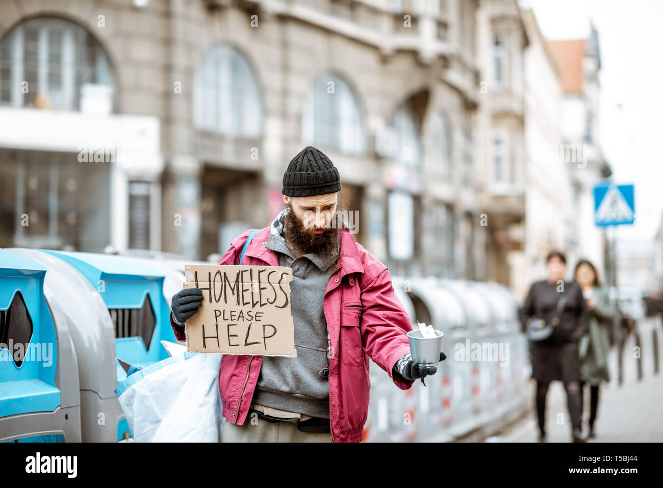Beggar and passerby hi-res stock photography and images - Alamy