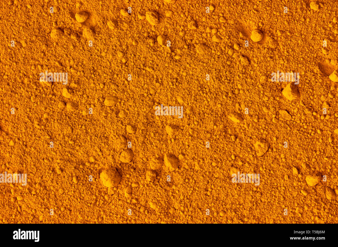 Orange powder background Stock Photo - Alamy