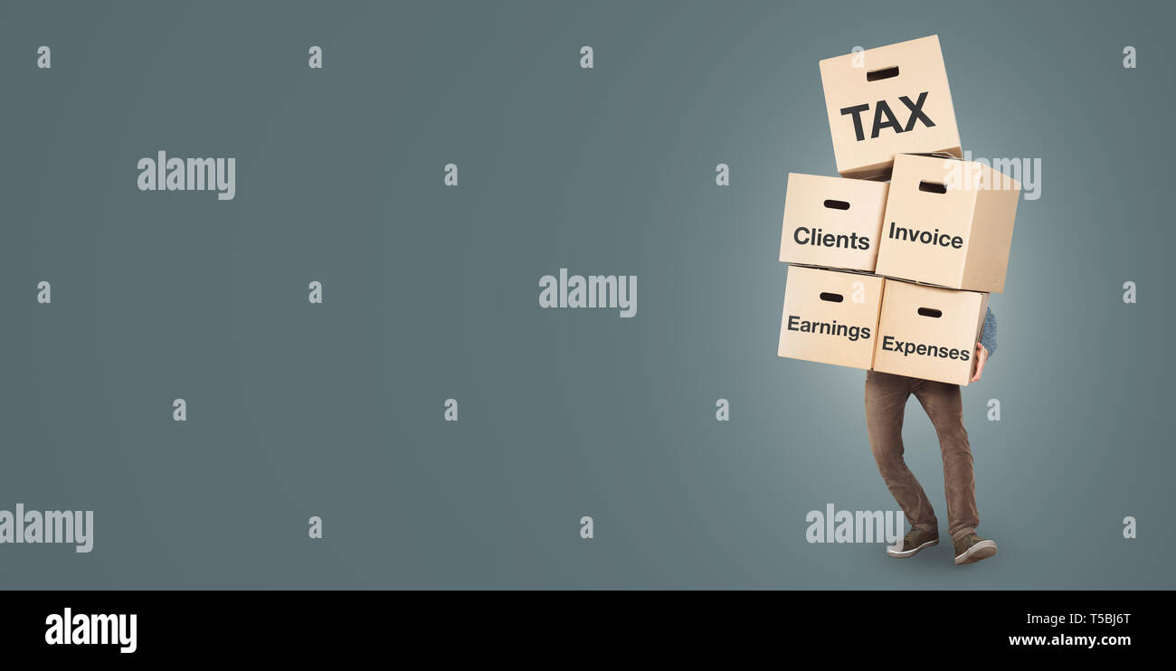 Accountant carrying a large stack of boxes for file storage Stock Photo ...