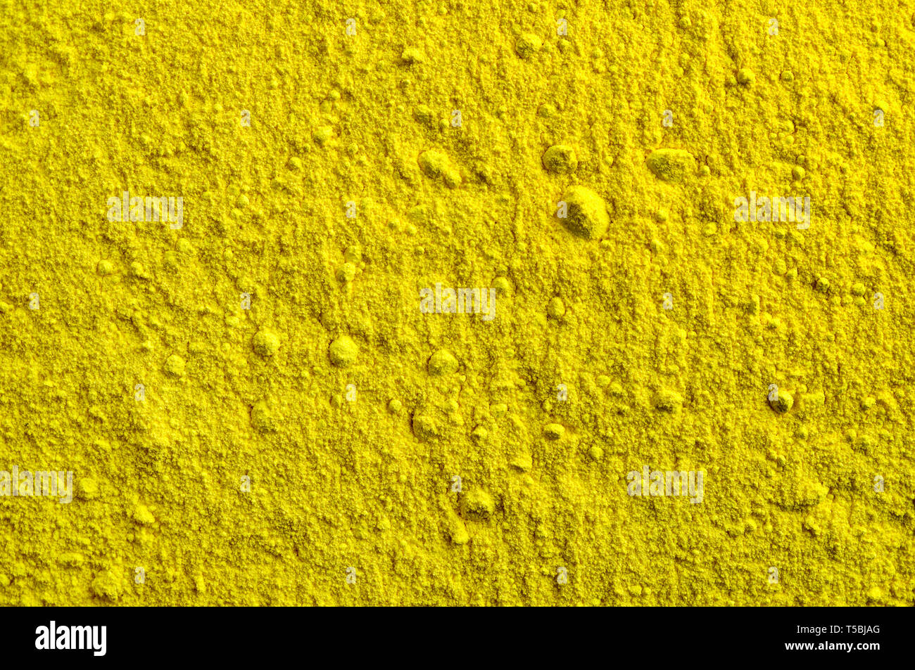 Yellow powder background Stock Photo - Alamy