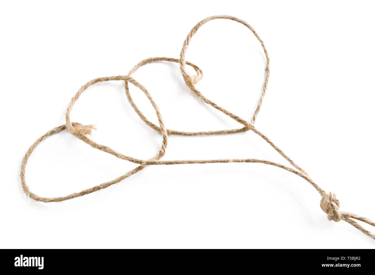 Hearts shaped rope on white background Stock Photo - Alamy