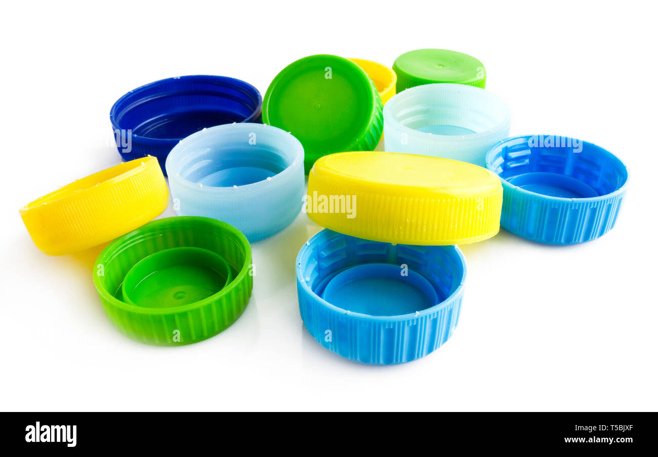 Stack of bottle caps isolated on white Stock Photo - Alamy