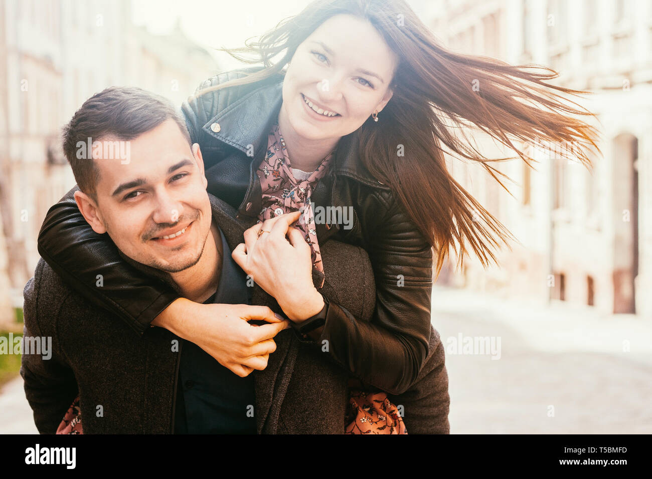 Young man giving piggyback ride hi-res stock photography and images - Alamy