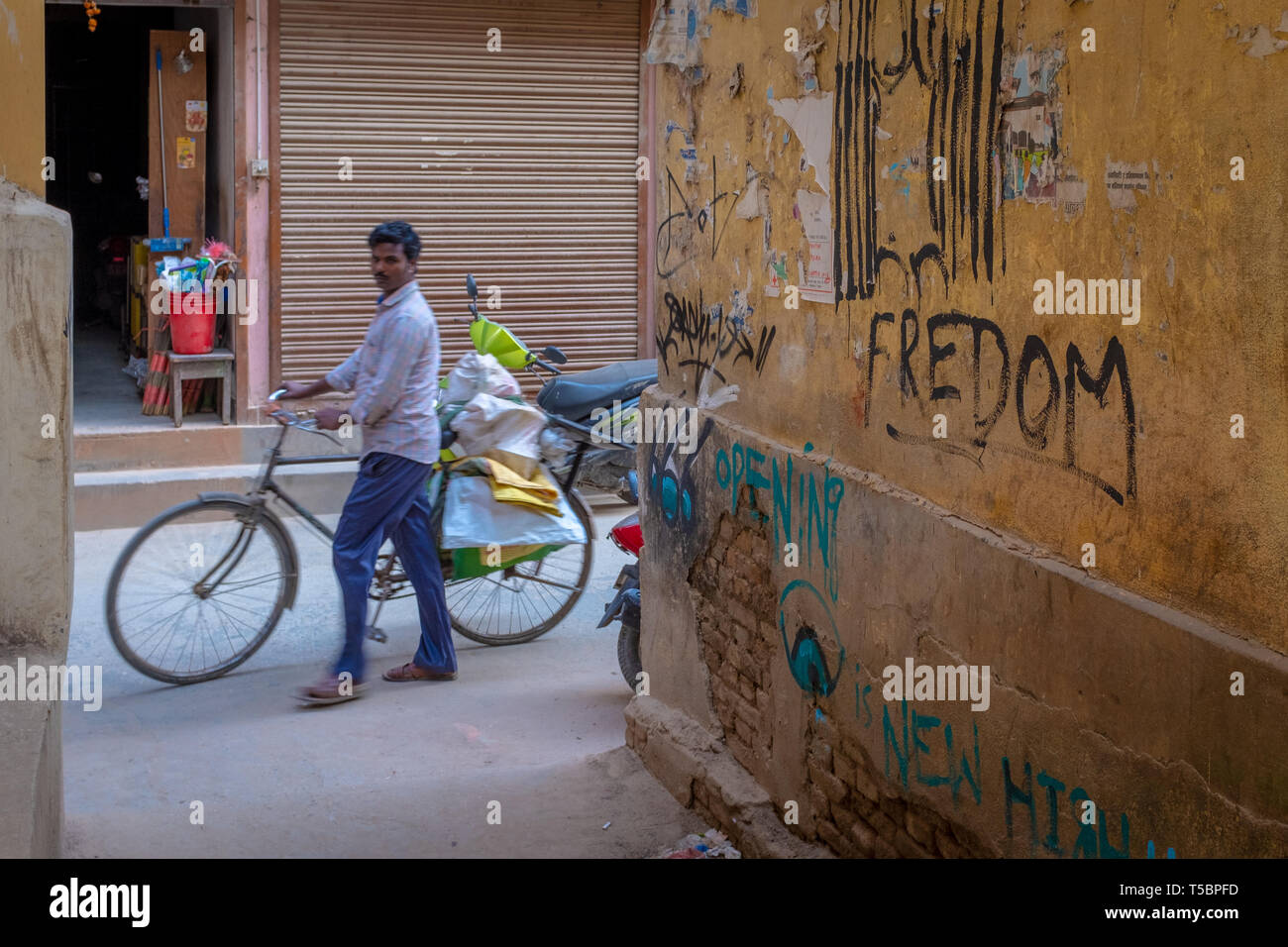 Indian man pushing bike hi-res stock photography and images - Alamy