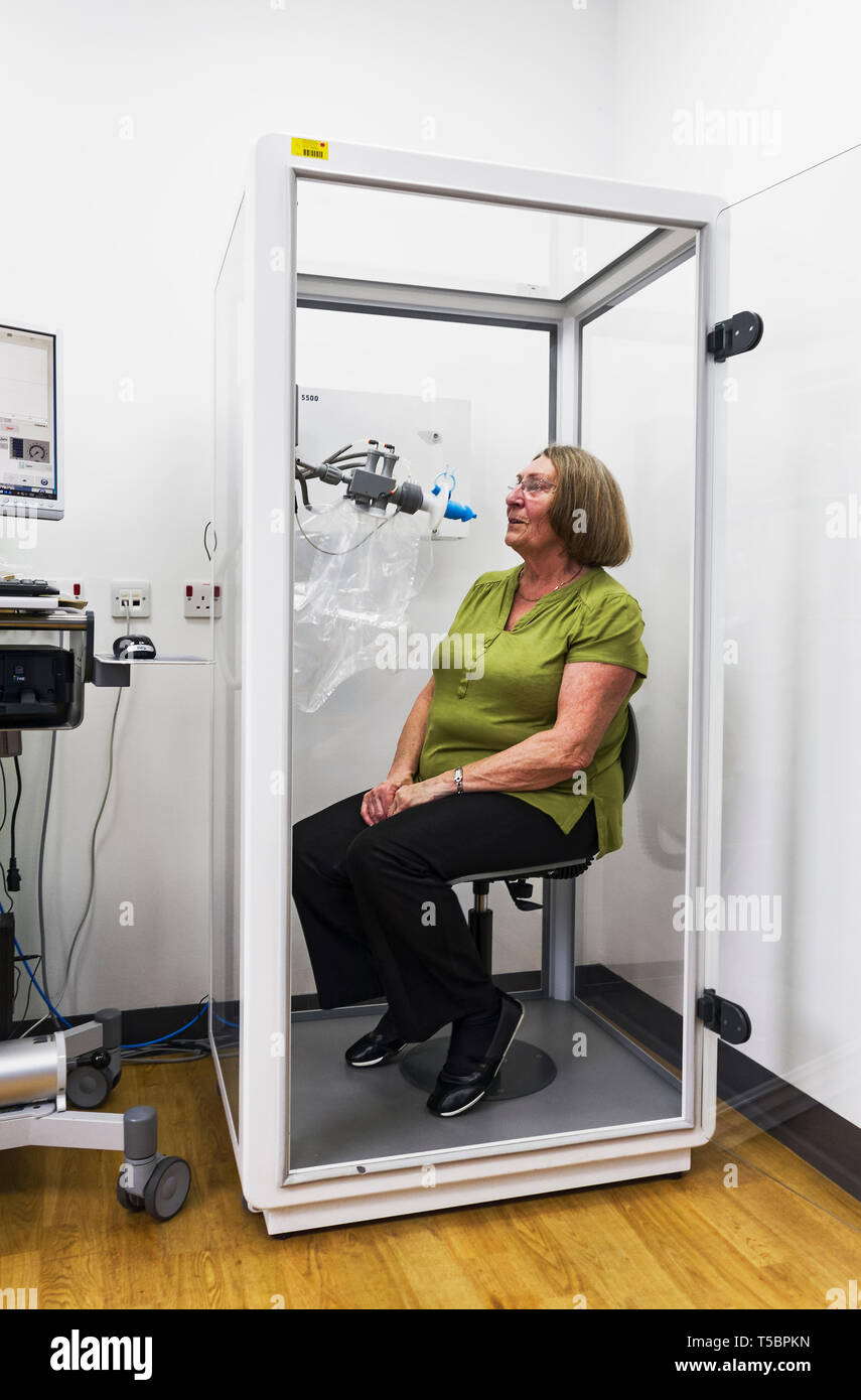 A hospital day patient tests lung function and capacity at a UK ...