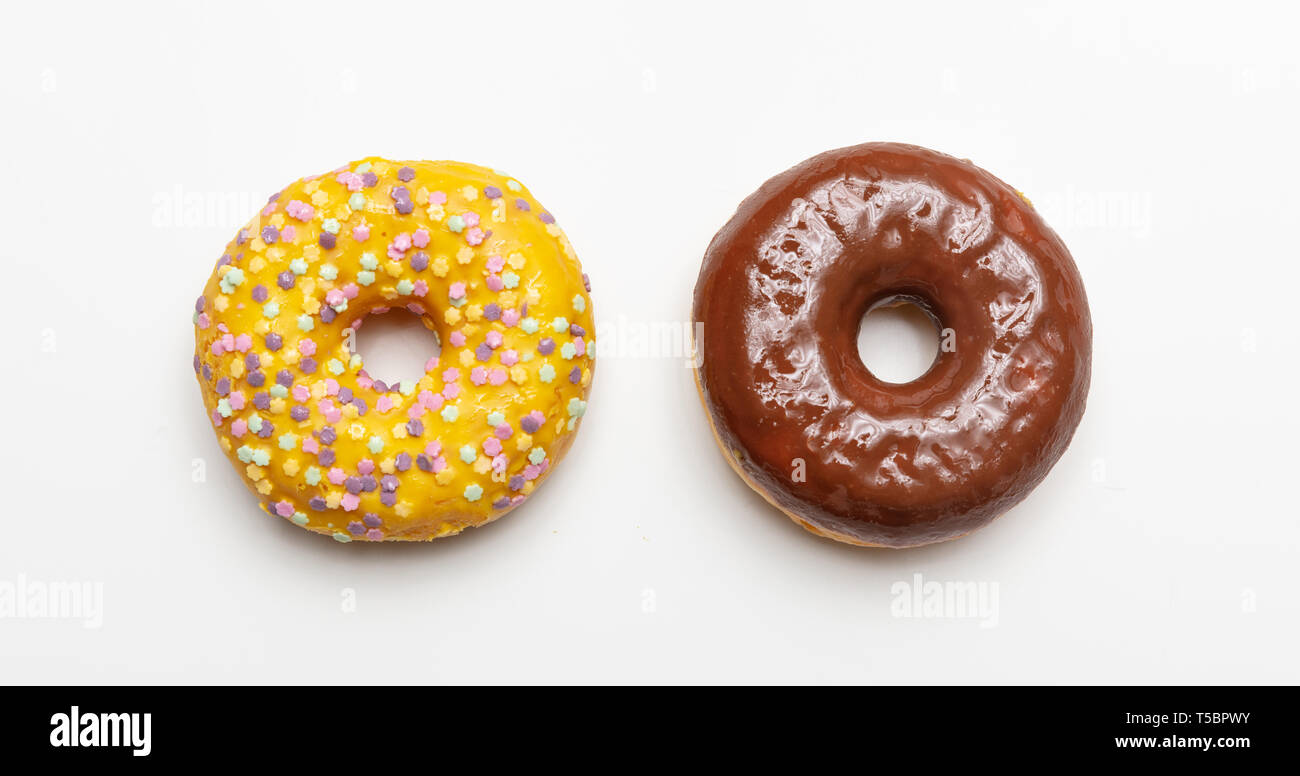 Two donuts chocolate and vanilla isolated on white color background ...