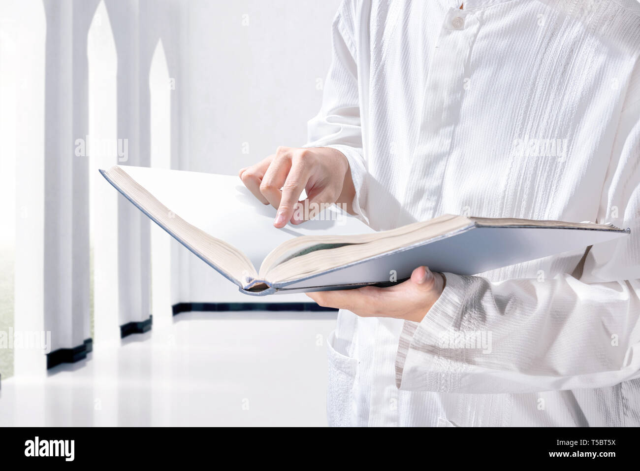 Muslim man reading quran in the mosque hi-res stock photography and ...