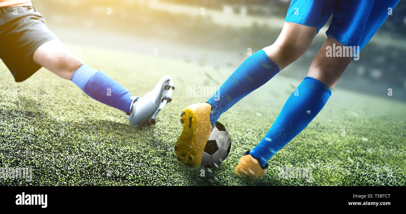 Football player woman sliding tackle the ball from his opponent on ...