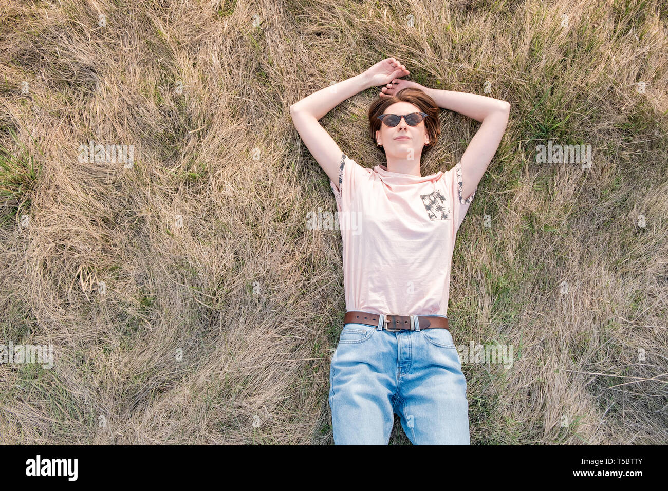 Woman laying down top view hi-res stock photography and images - Alamy