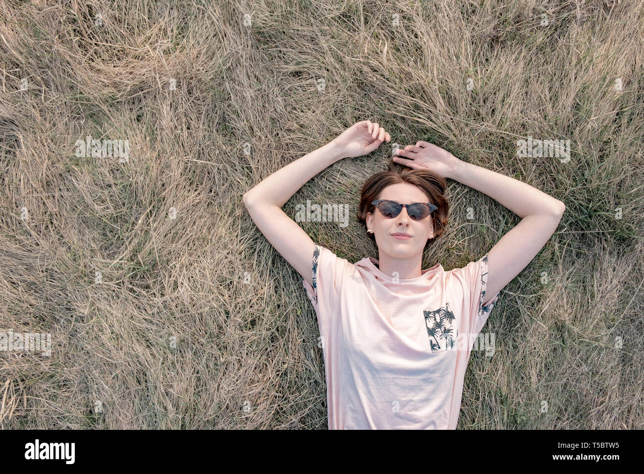 Woman laying down top view hi-res stock photography and images - Alamy