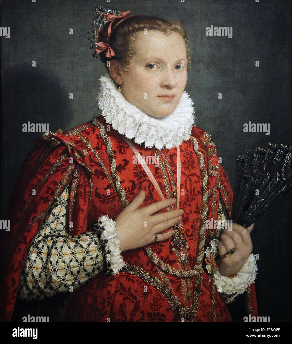 Portrait of a young woman holding a fan by Giovanni Battista Moroni ...