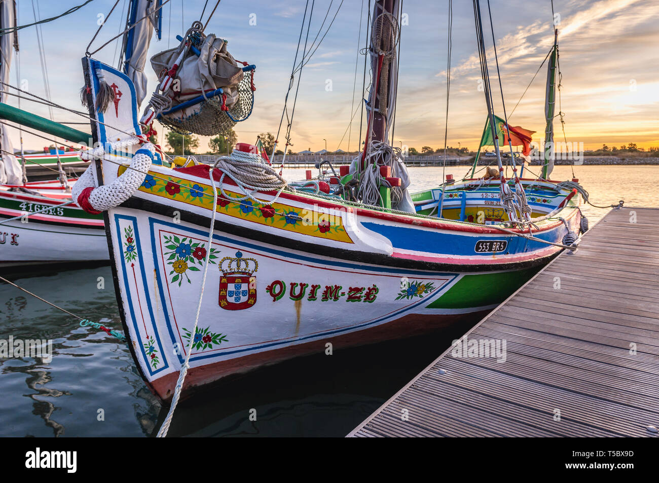 Traditional painted boats in port of Moita town, Setubal District in ...