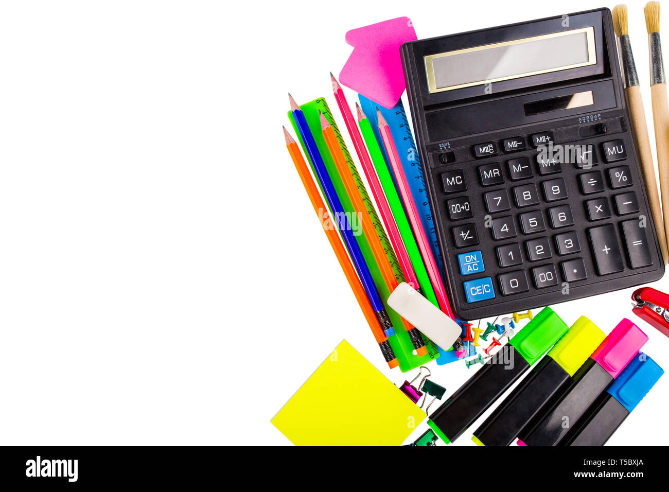 Stationery isolated on white. Calculator, markers, pencils, rulers ...