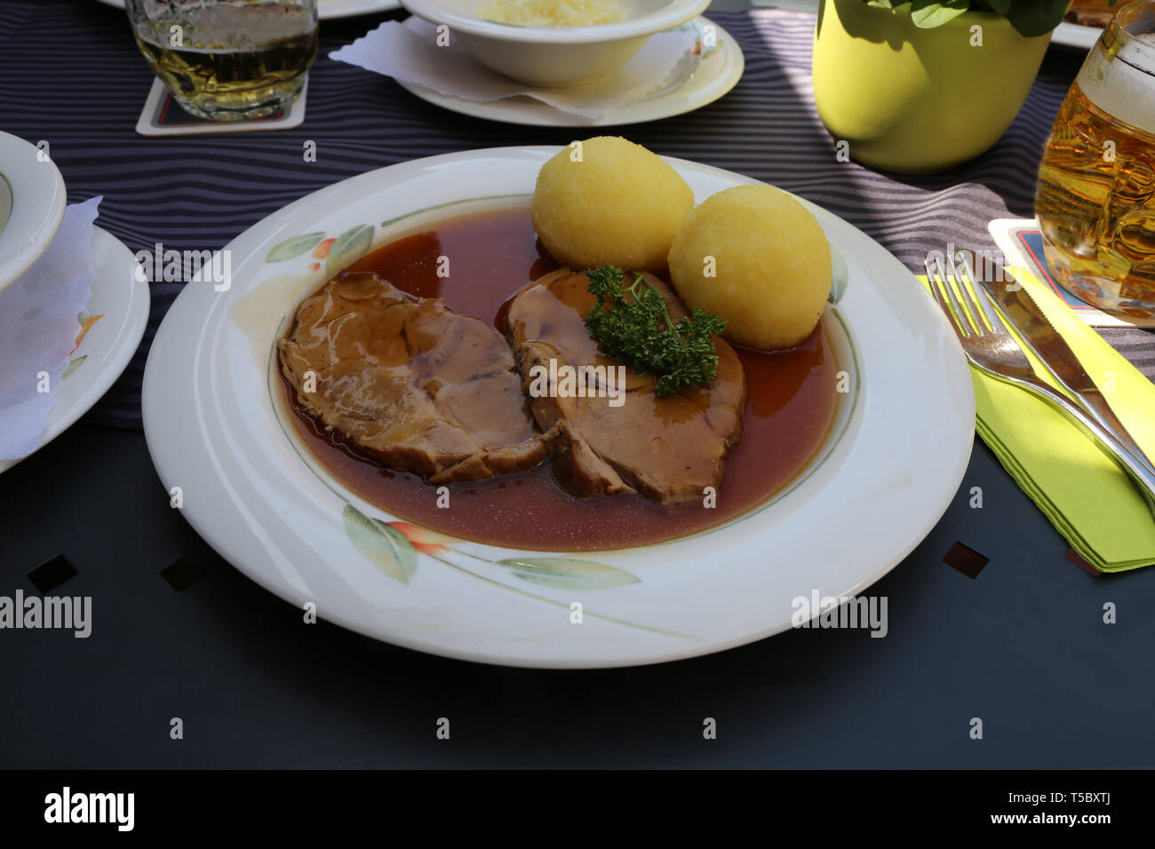 Bavarian cuisine roast pork potato dumpling hi-res stock photography ...