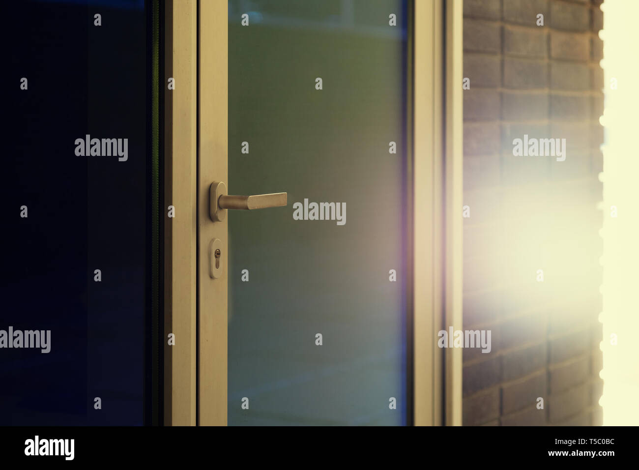 Closed glass door in the sunlight Stock Photo - Alamy
