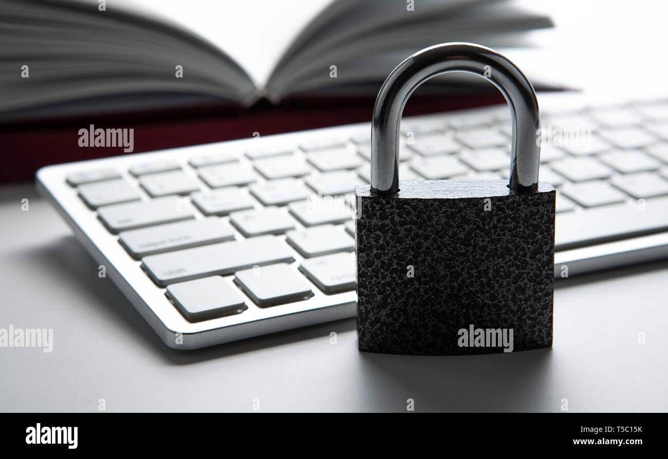 padlock with a computer keyboard close up Stock Photo - Alamy