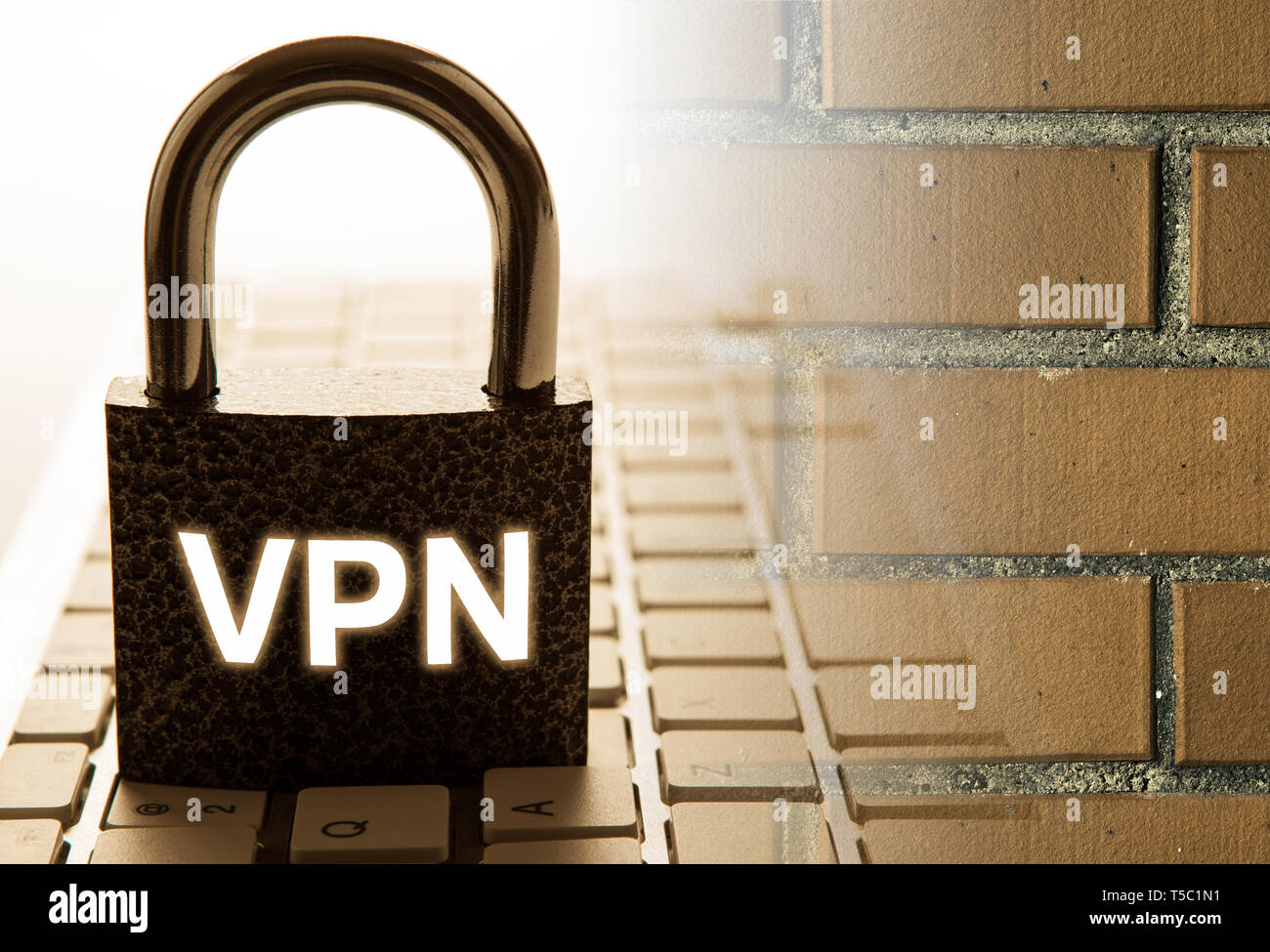 padlock with inscription VPN with the computer keyboard with brick wall ...