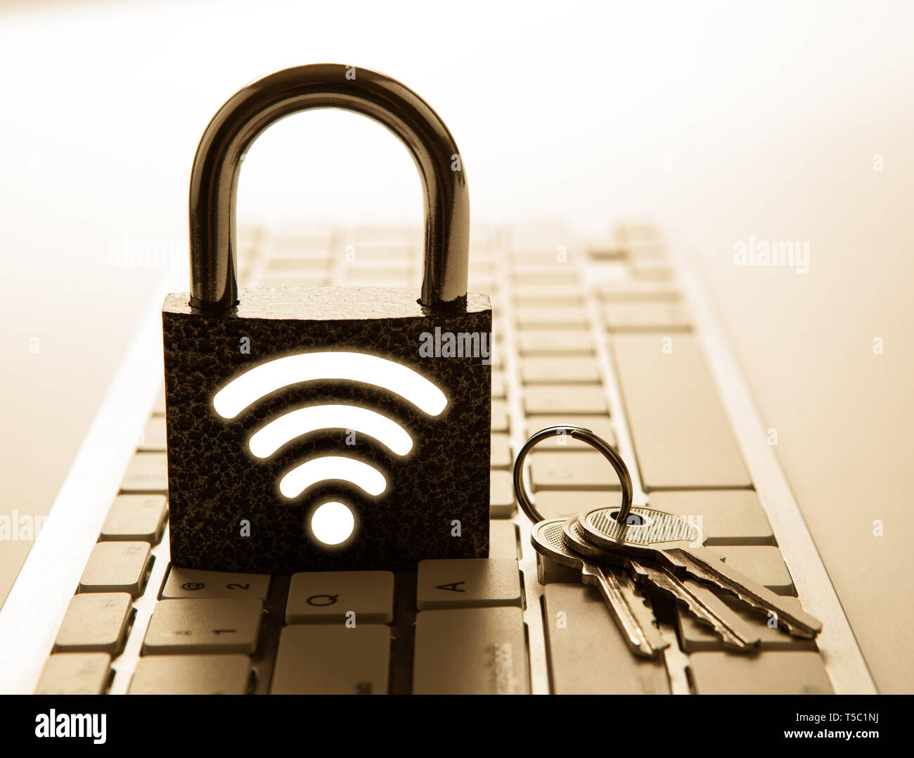 padlock with passwrod wi-fi with keys on the computer keyboard close up ...