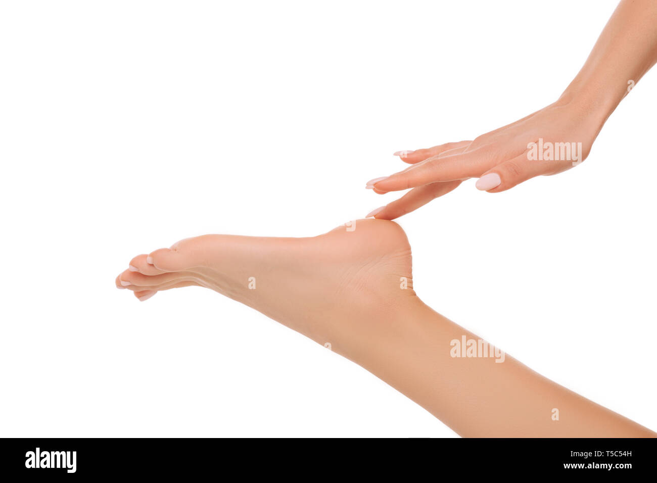 woman touching her smooth foot. Spa and foot care isolated on white ...