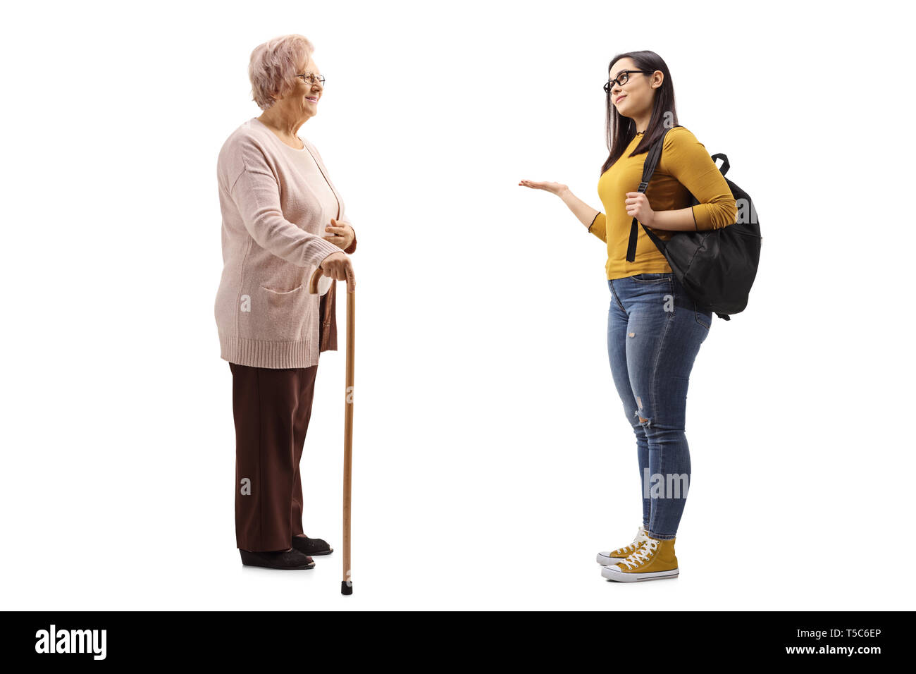 Full length profile shot of a senior woman with a cane and a female ...