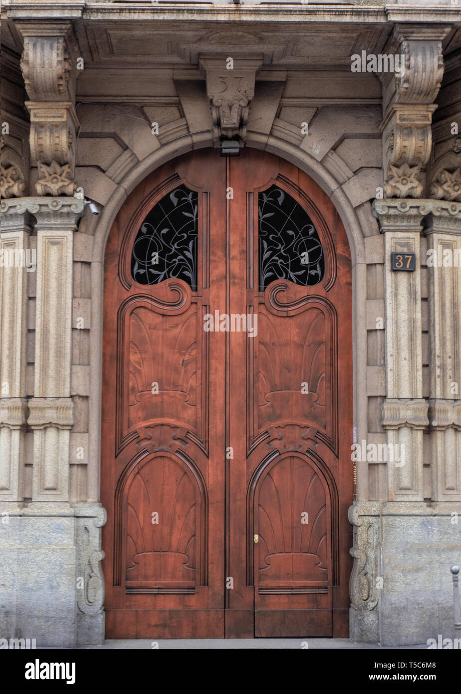 Milan - Italy, elegant arched entrance in Liberty style Stock Photo - Alamy