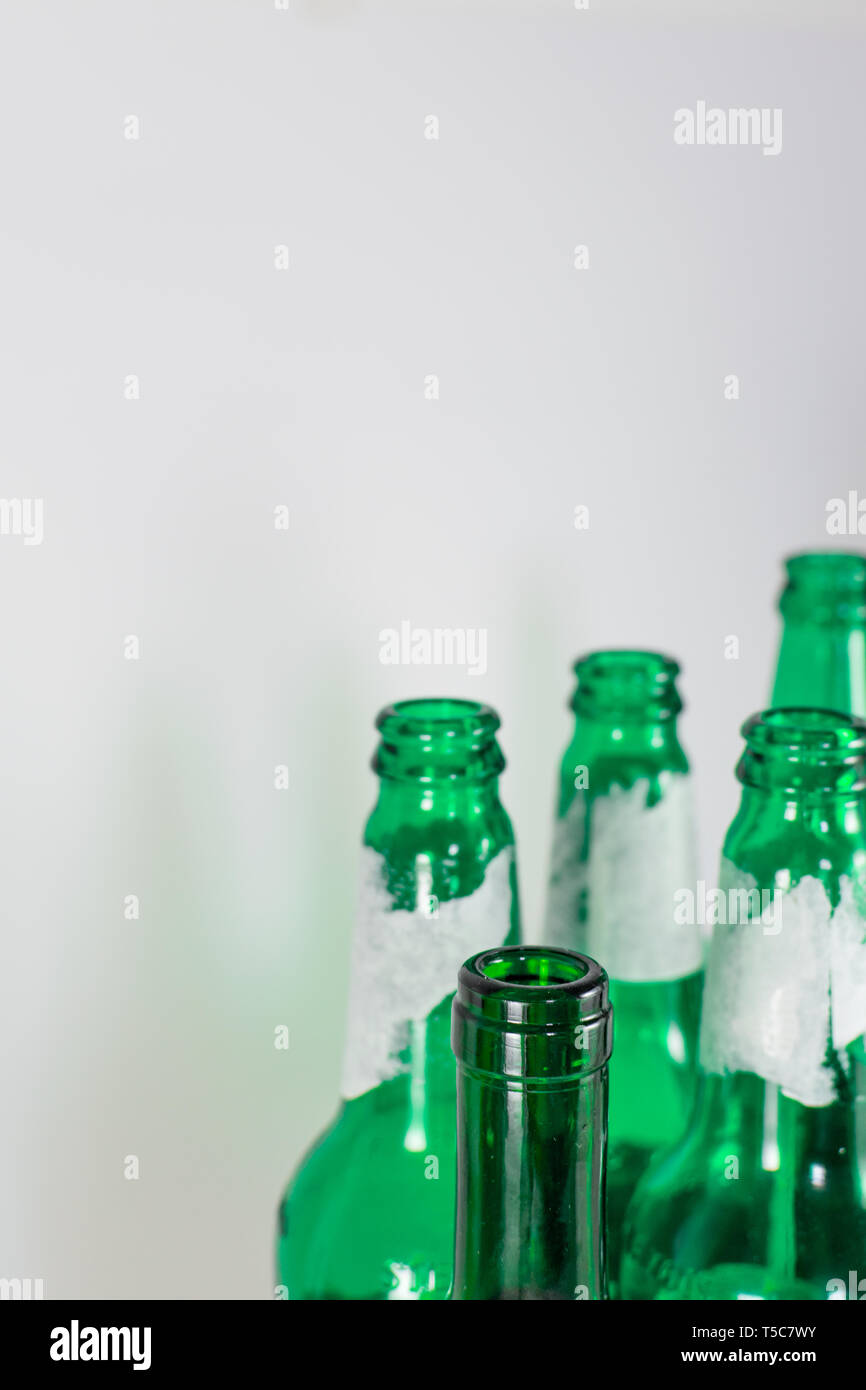 Image of the bottleneck of empty beer and wine green glass bottles on a ...
