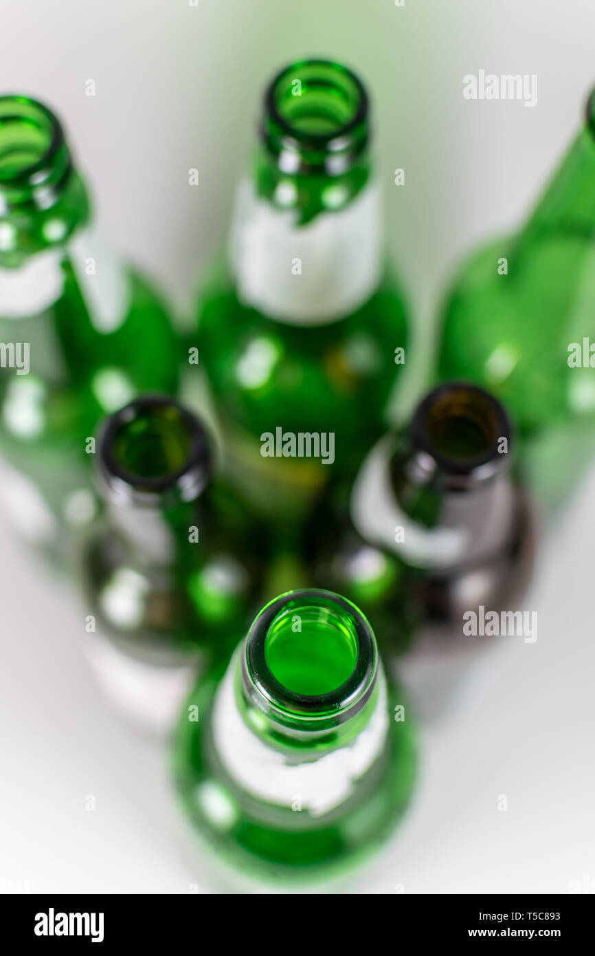 Top view of a pack of blurred empty green and brownlongneck beer glass ...