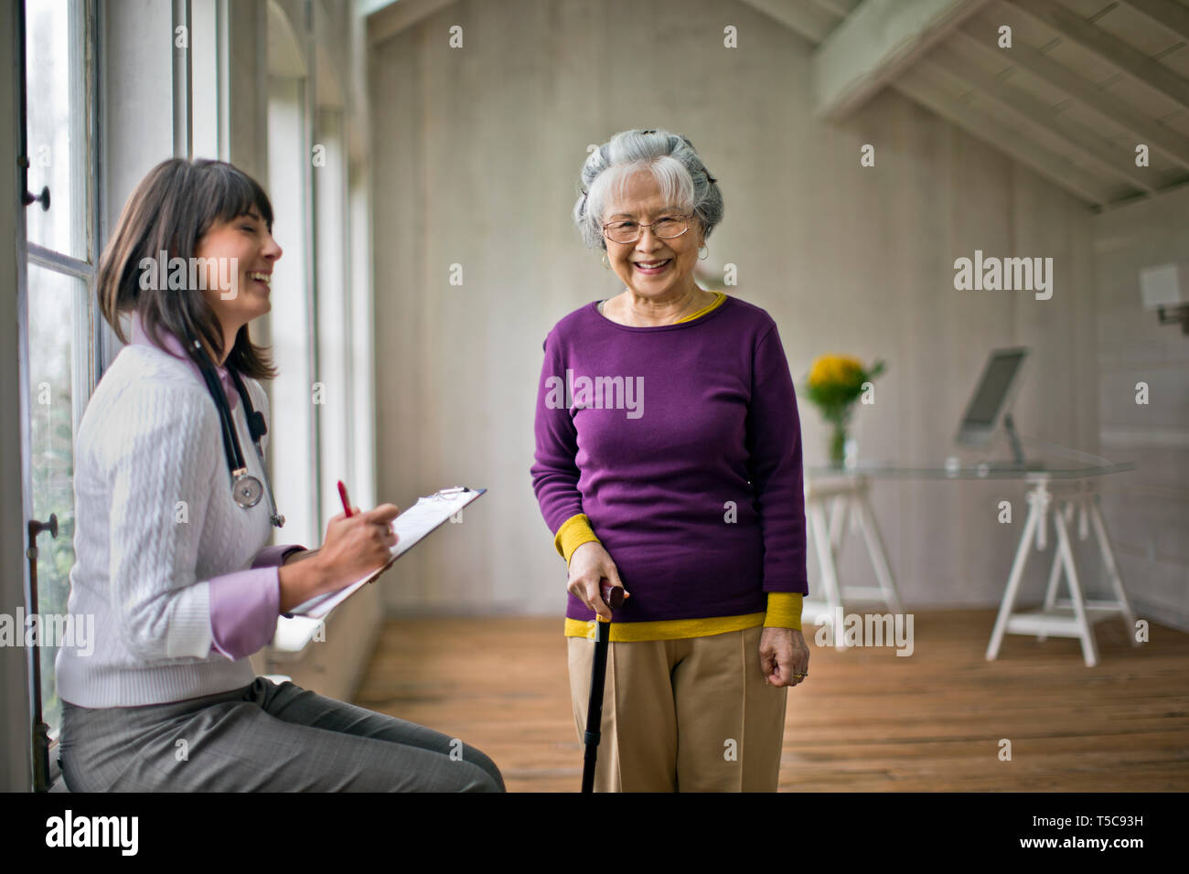 Elderly woman at a medical check-up with her doctor Stock Photo - Alamy