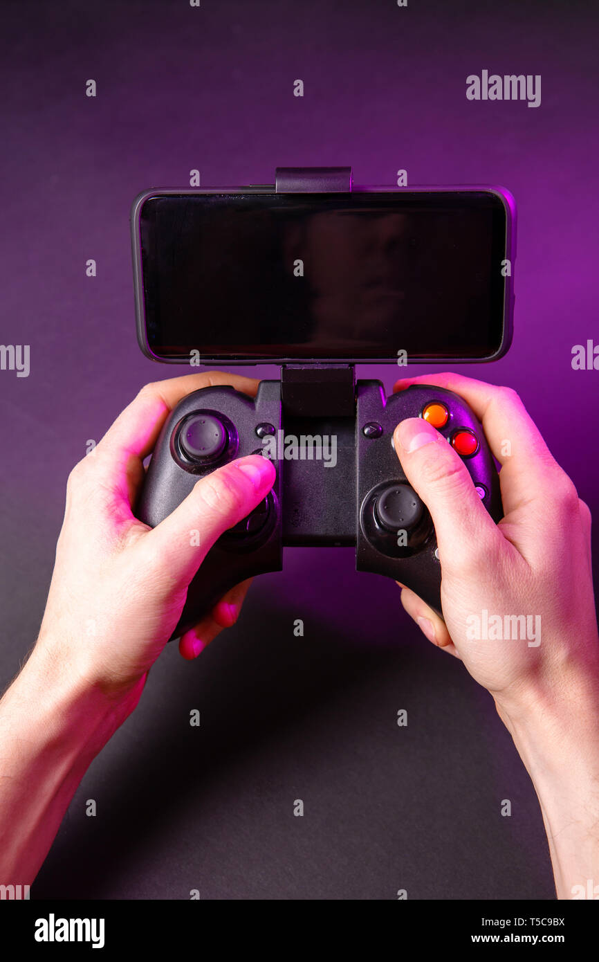 Man hands playing a computer game with a game joystick Stock Photo - Alamy