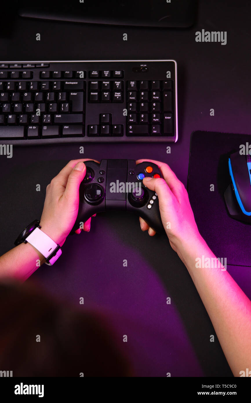 Female hands playing a computer game with a game joystick Stock Photo ...