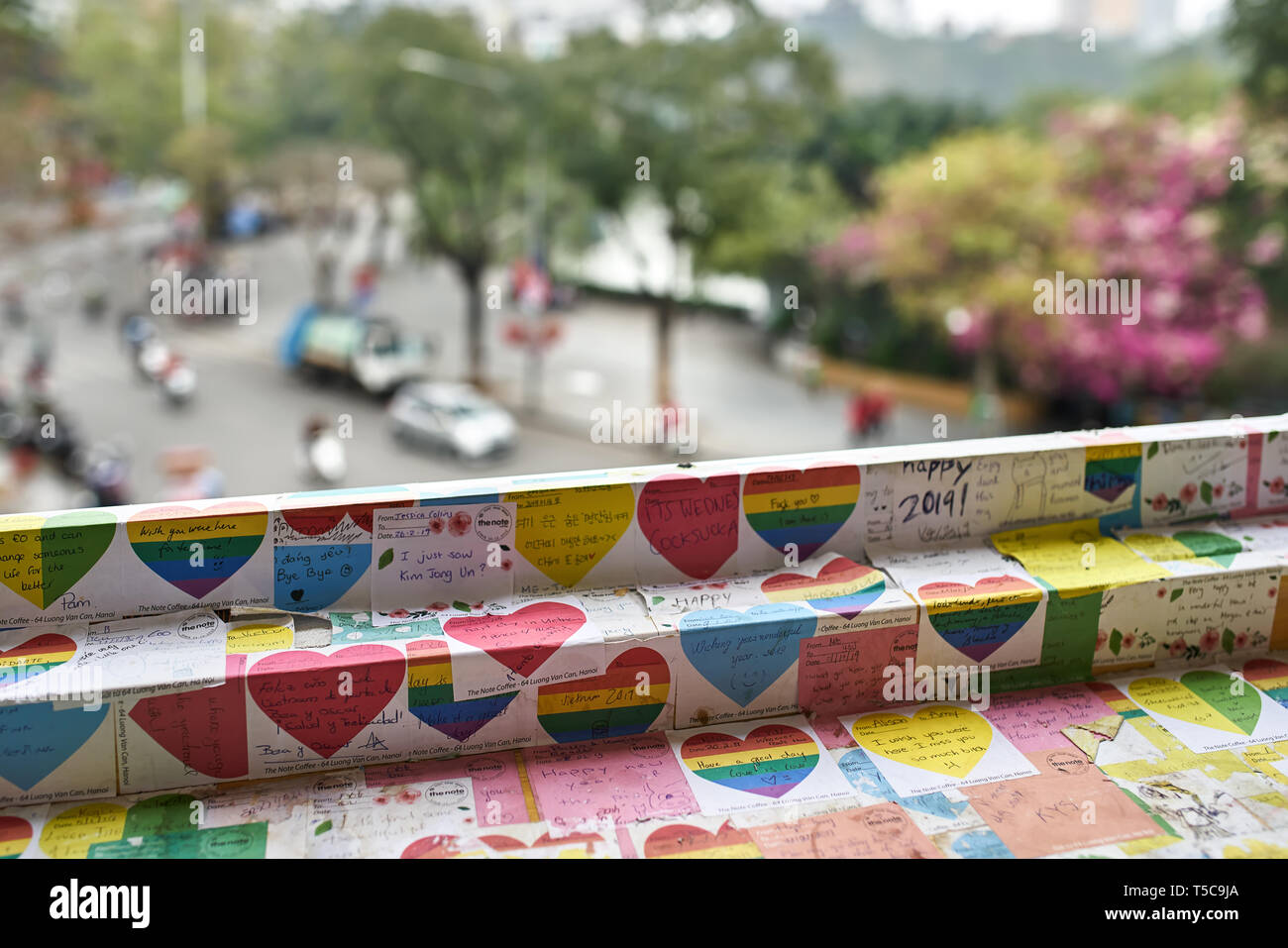 Multicolored postcards pasted on interior of unusual cafe Stock Photo ...