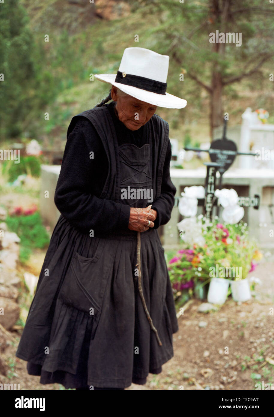 Grieving old woman in a cemetery Stock Photo - Alamy