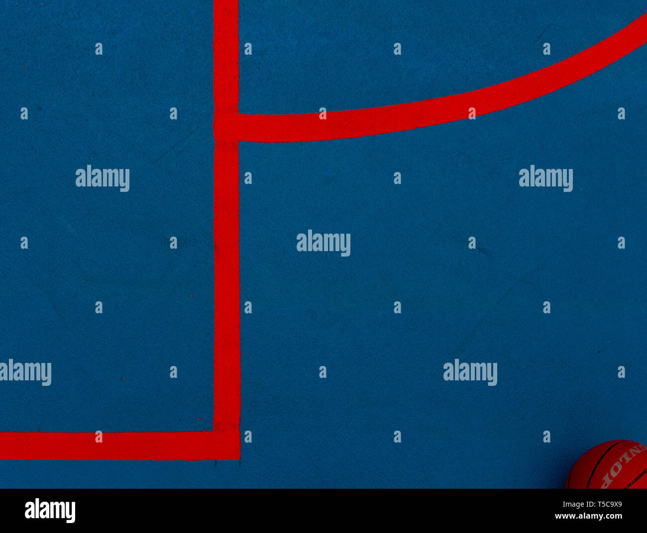 A blue basketball court with red lines Stock Photo - Alamy
