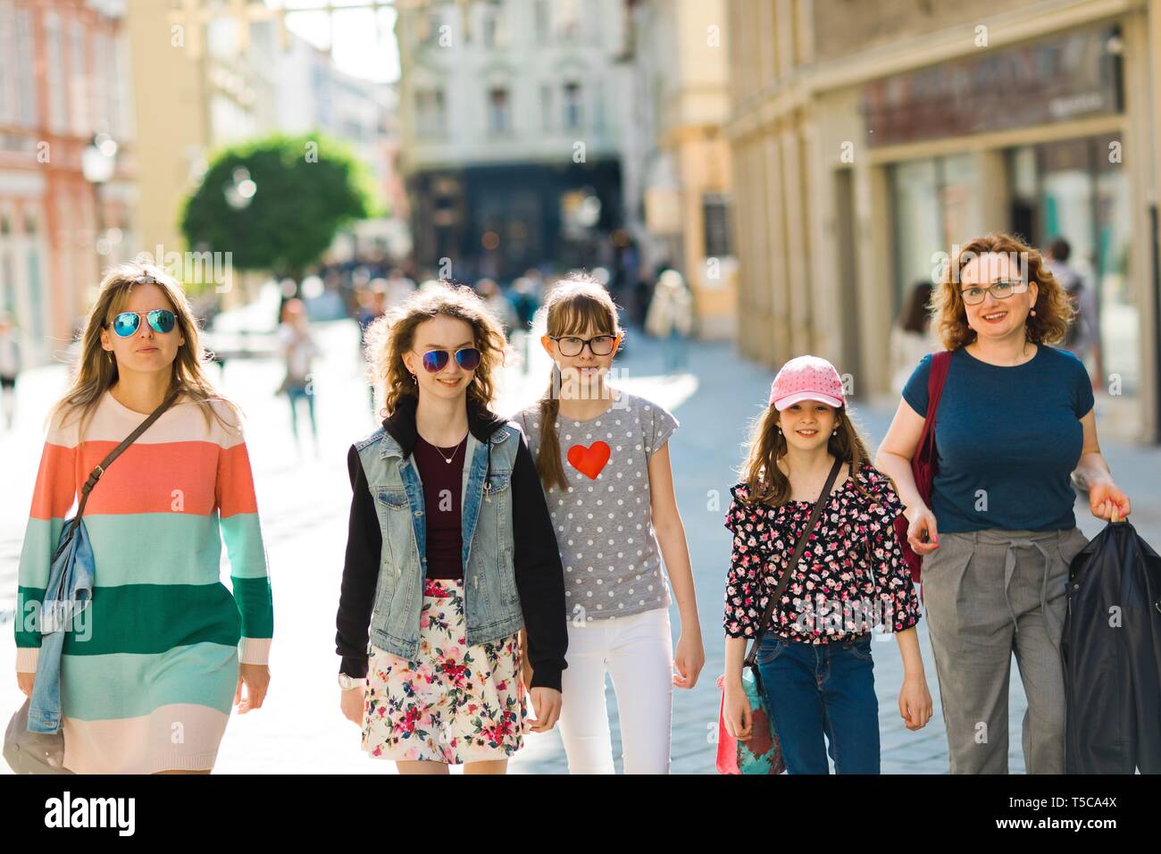 Group of girls walking downtown hi-res stock photography and images - Alamy